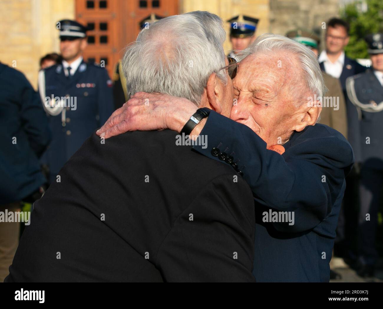 Two original members of the 1956 uprising embrace June 28, 2023, during ...