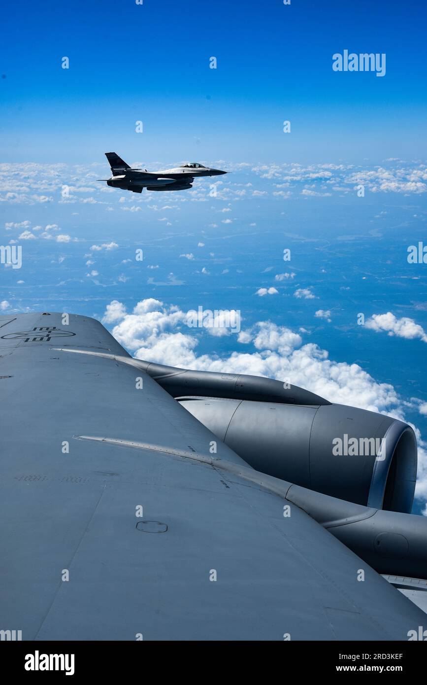 An F-16 from the 169th Fighter Wing in South Carolina escorts a KC-135 ...