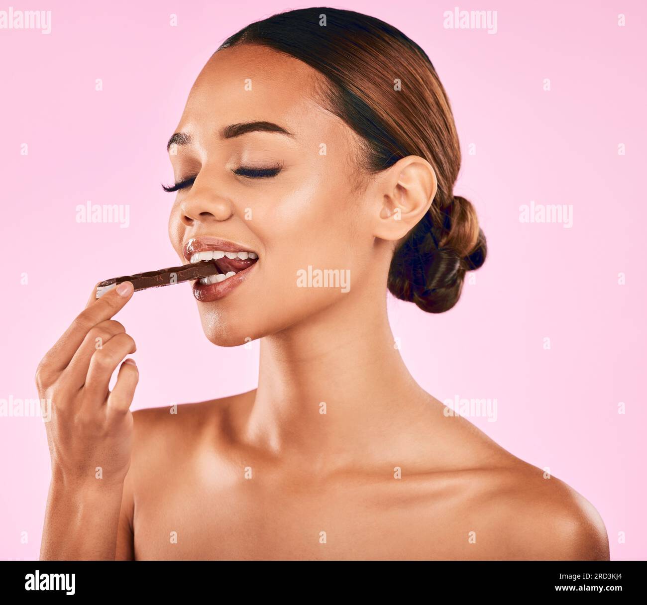 Woman is eating chocolate, health and beauty with candy, skincare and ...