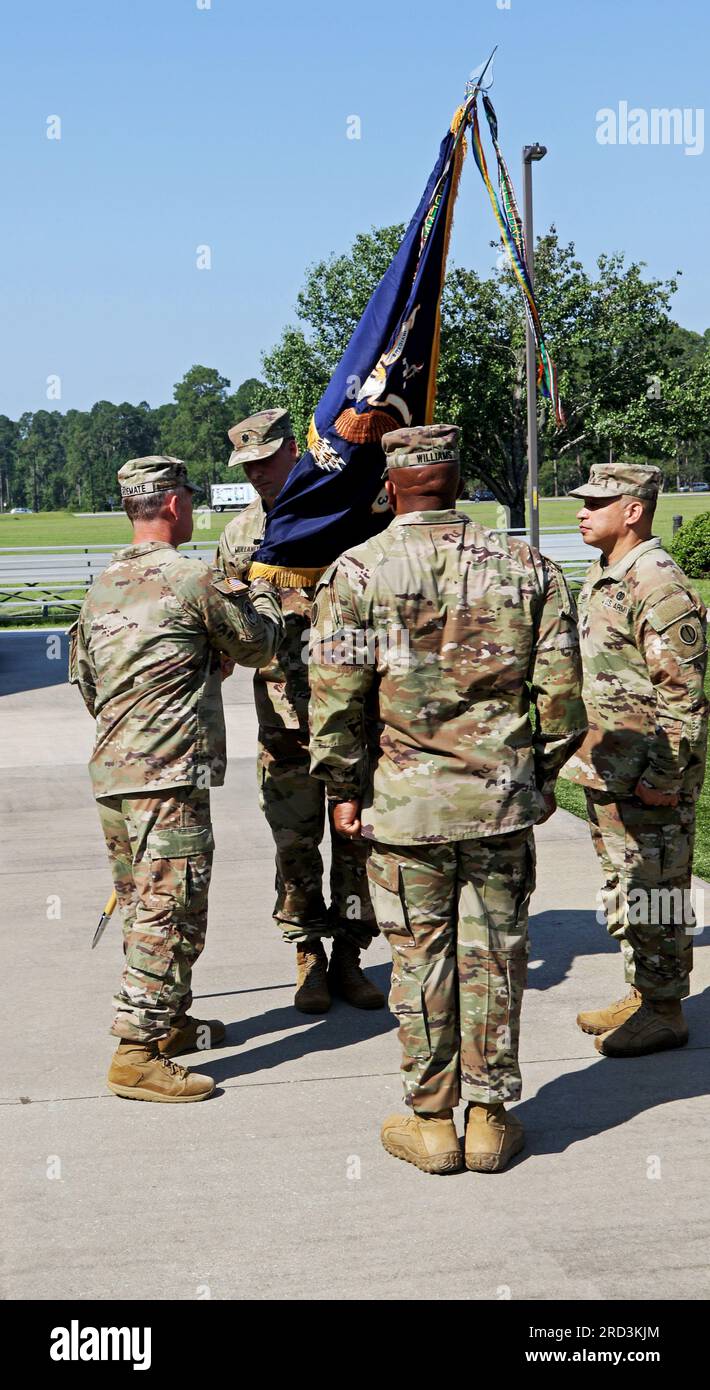 Col. William Shoemate II, the 188th IN BDE commander, passes the colors to Lt. Col. Gary ...