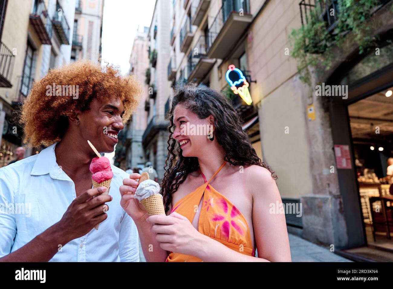 youn tourists couple in love eating ice cream at Gothic Quarter ...