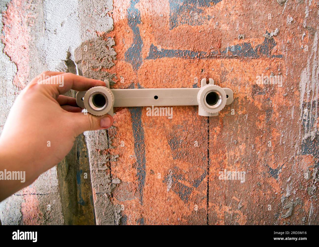 fittings in plumbing for hot and cold water in the wall Stock Photo - Alamy