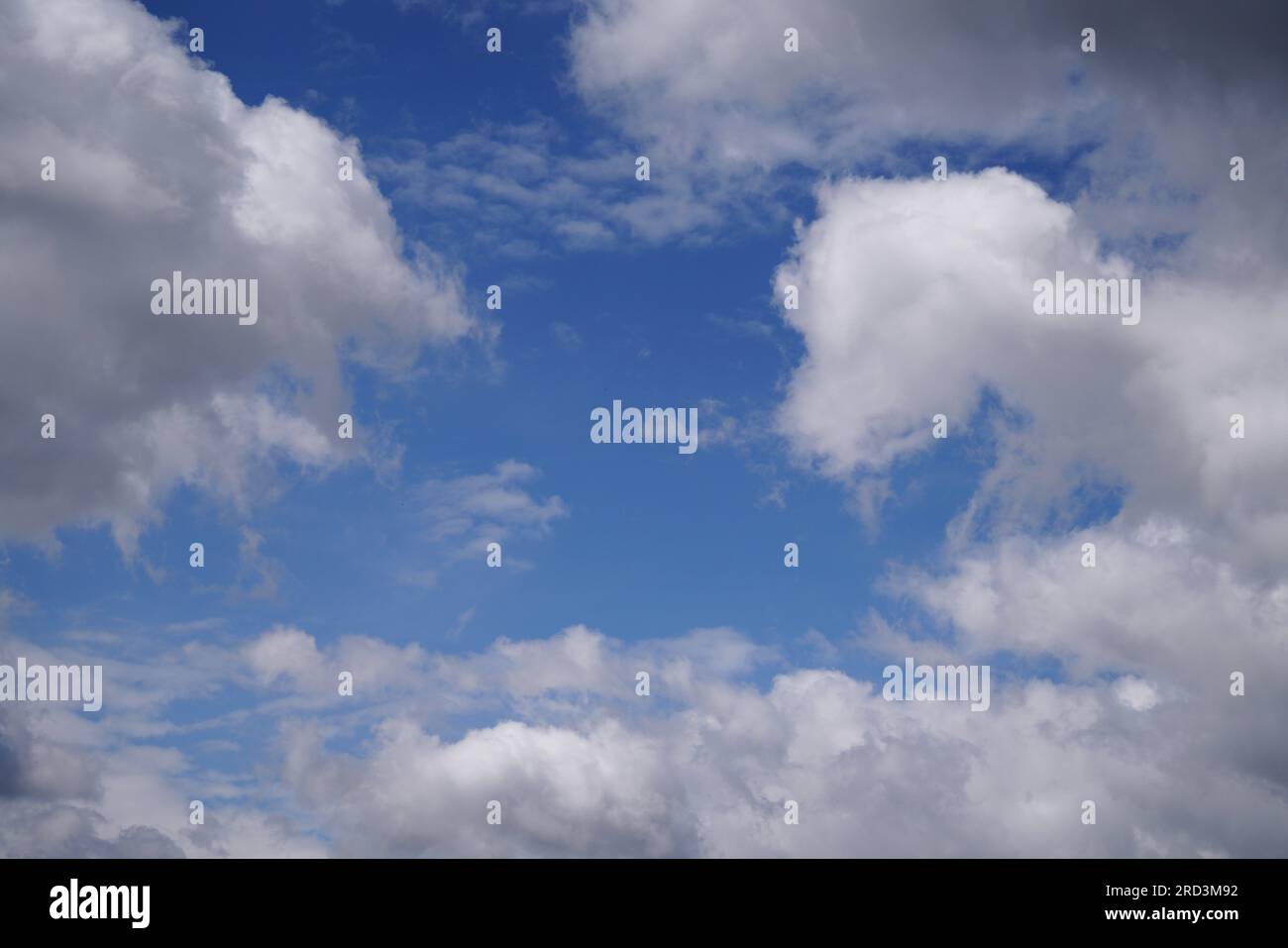 Stratus cumulus alto nimbo clouds in the blue sky are weather ...
