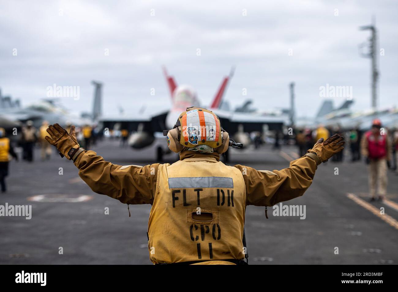 230627-N-KU796-1023 PACIFIC OCEAN (June 27, 2023) A U.S. Navy Sailor directs an F/A-18F Super ...