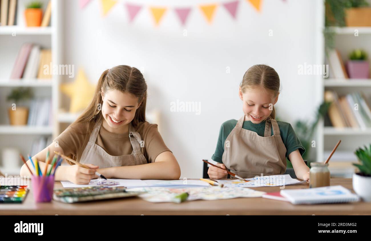 Happy kids at the art class. Children are painting together Stock Photo ...
