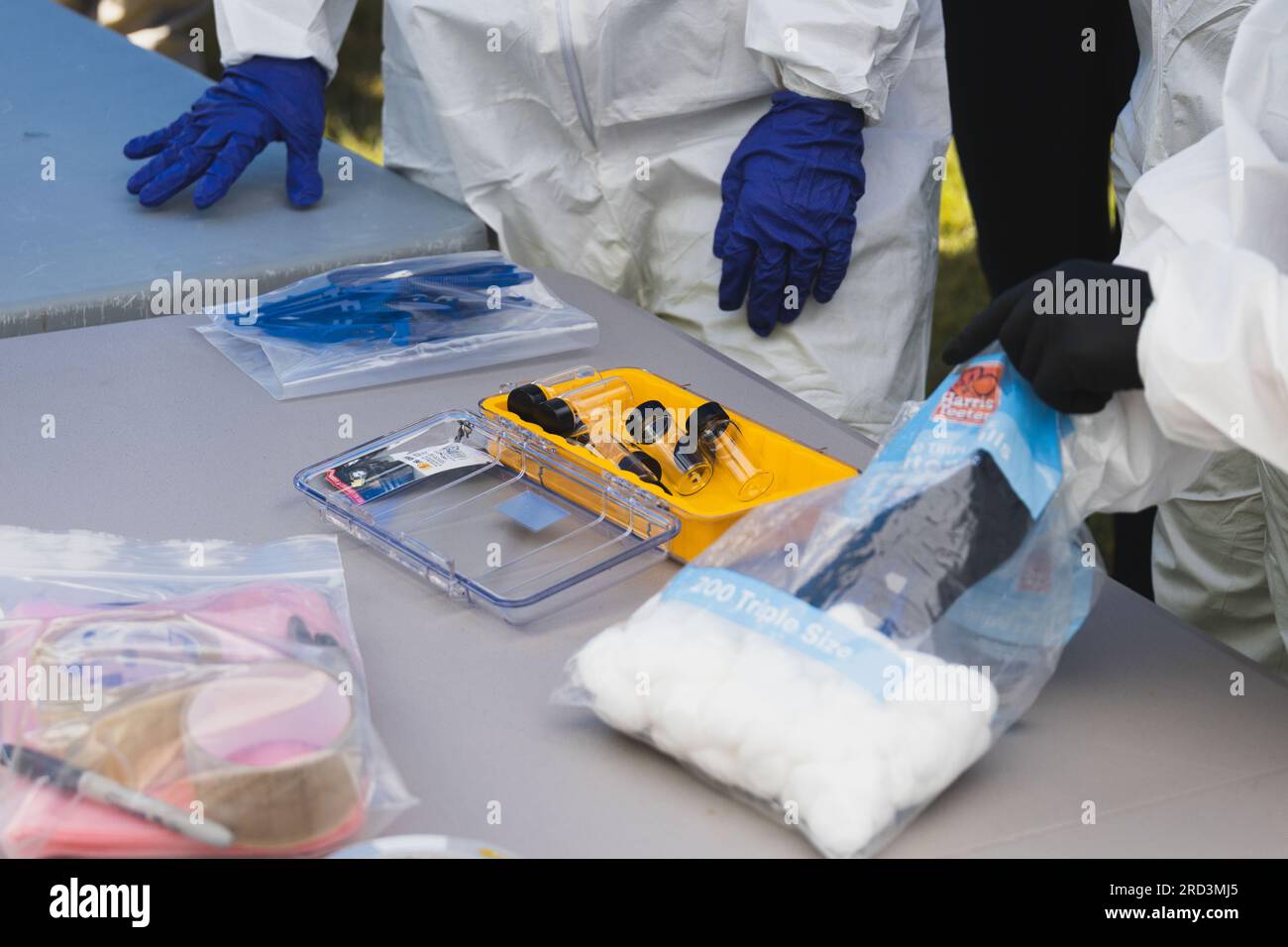 Agents with the Federal Bureau of Investigation prepare to take samples ...