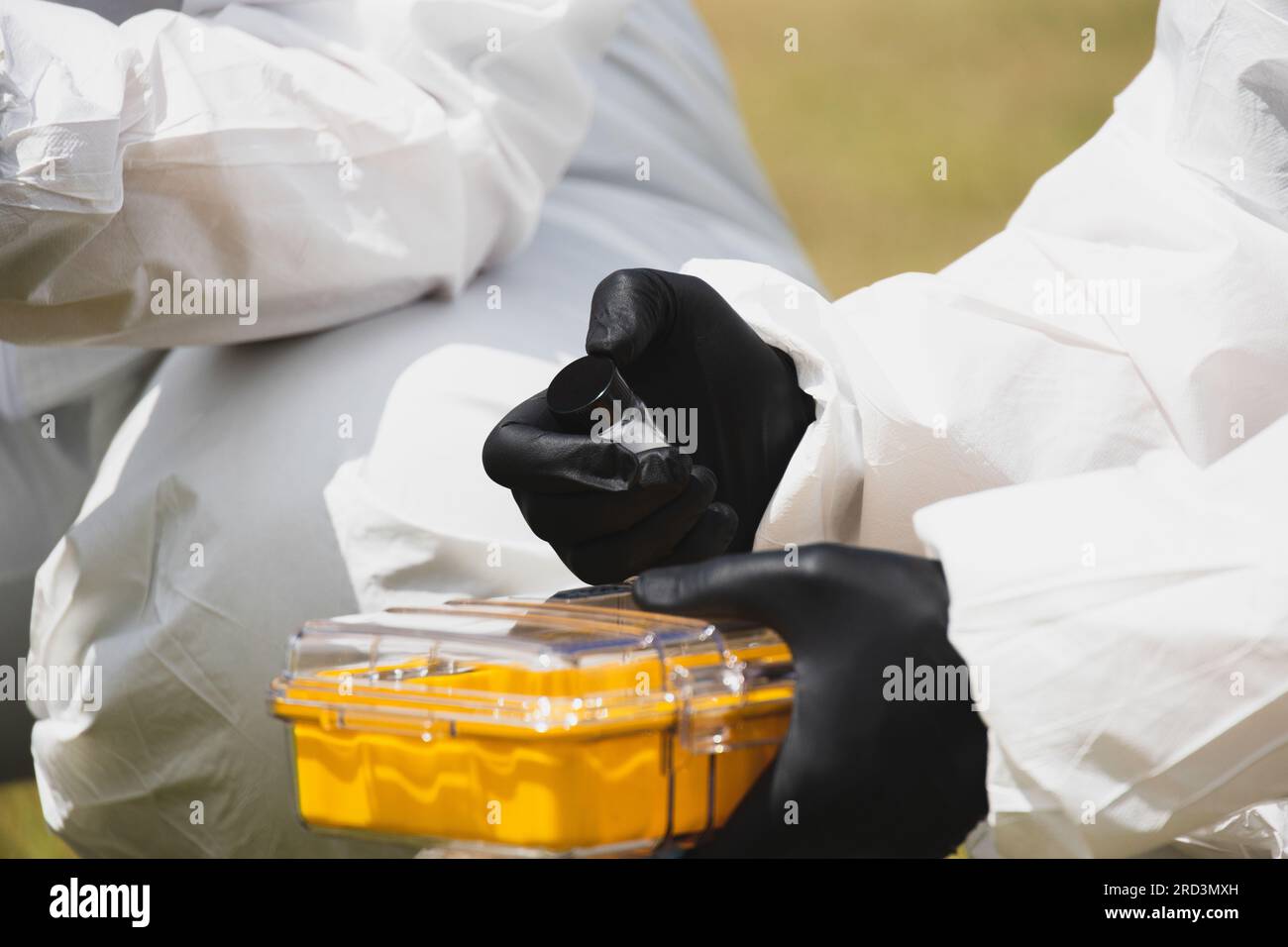 Agents with the Federal Bureau of Investigation take samples of ...