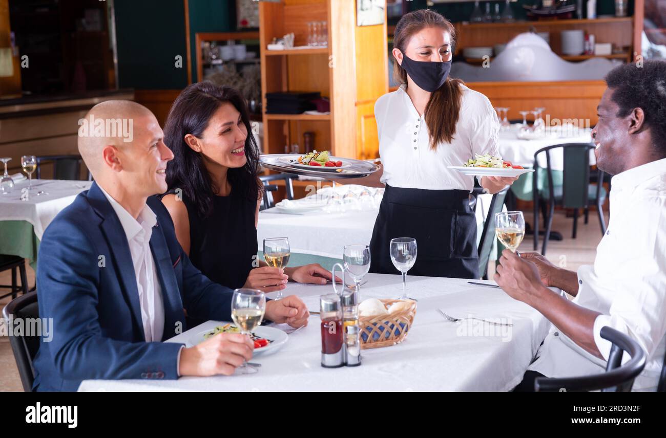 Friendly waitress in protective hi-res stock photography and images - Alamy