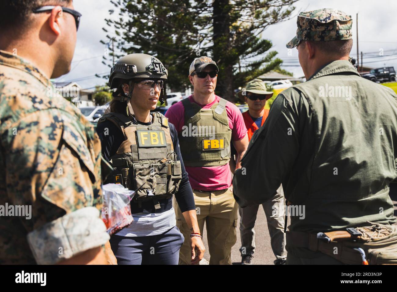 Agents with the Federal Bureau of Investigation speak with U.S. Marine ...