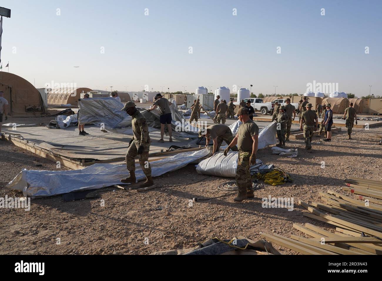 Airmen from the 378th Expeditionary Civil Engineer Squadron disassemble ...