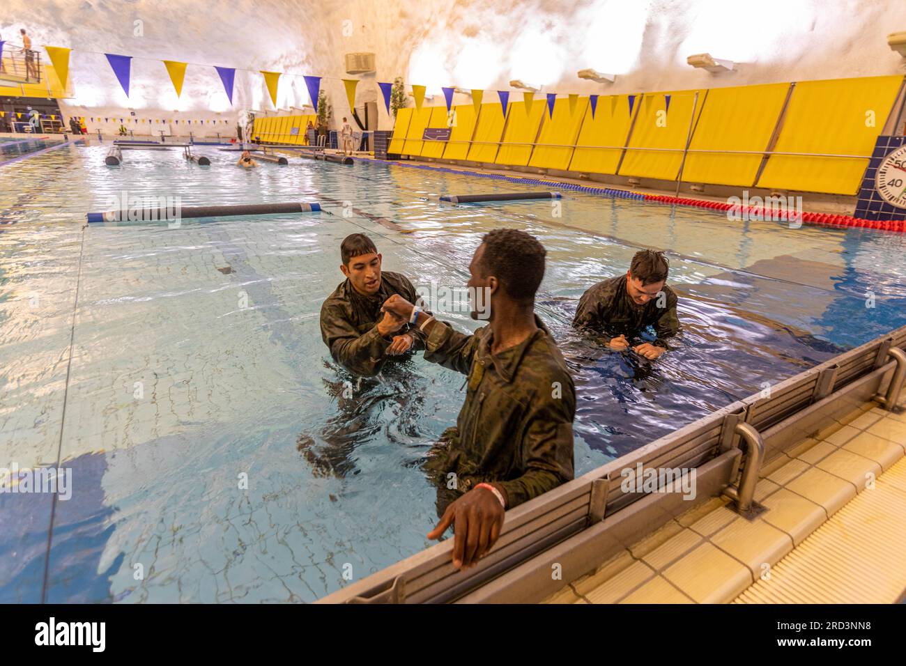Army Reserve Capt. Steven Tirado, U.S. Army Reserve Legal Command, left ...