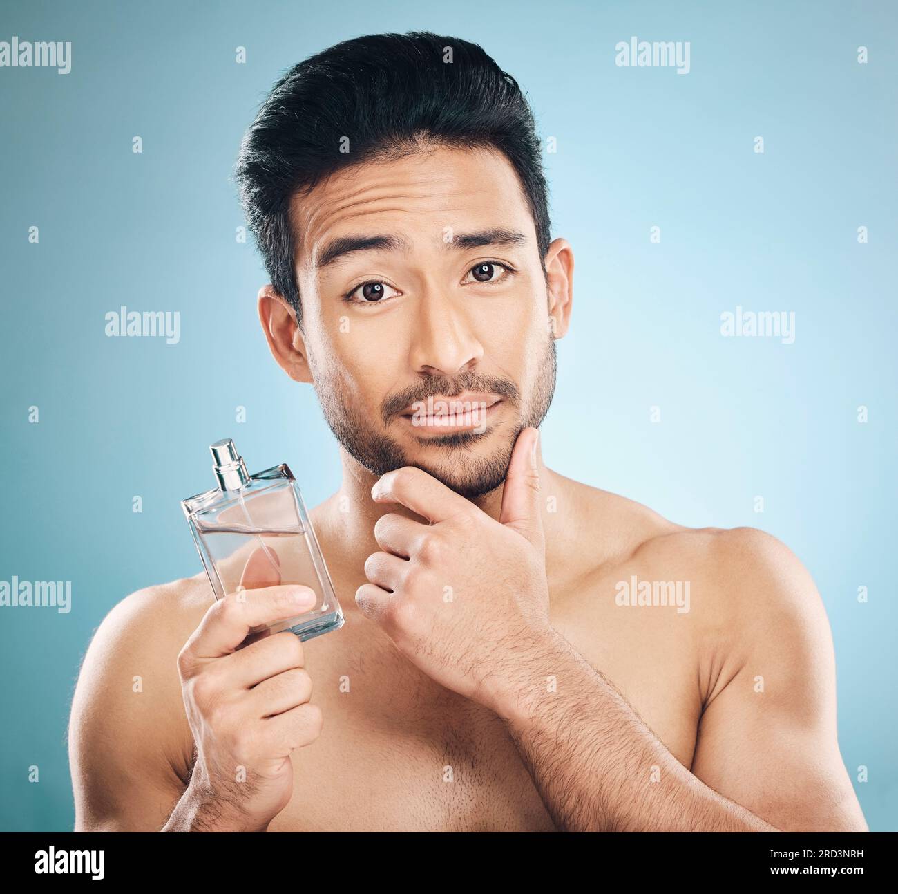 Portrait, cosmetics and man with cologne, beauty or self care against a ...