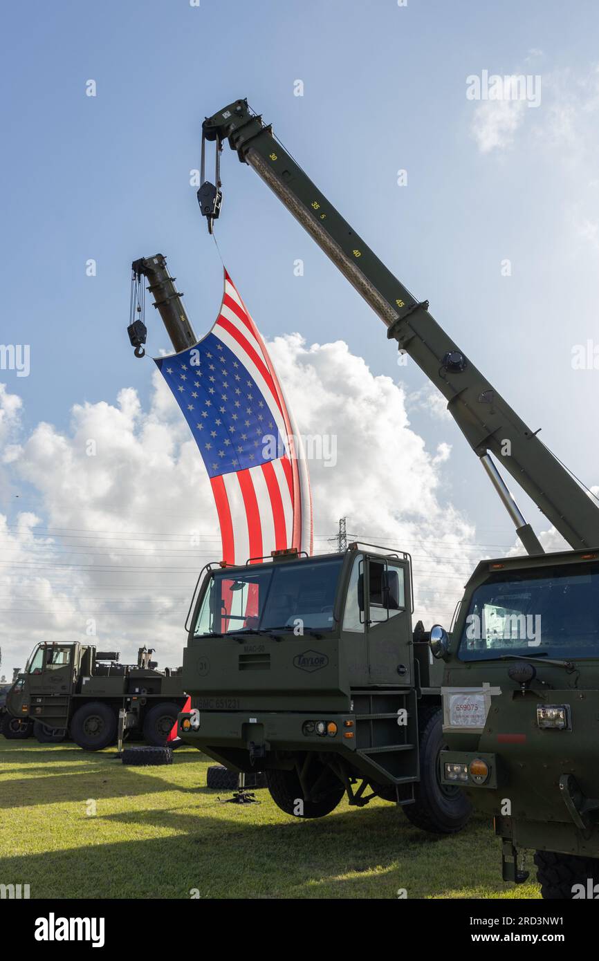 A U.S. Flag is hung from a Terex-Demag Military All-Terrain Crane ...