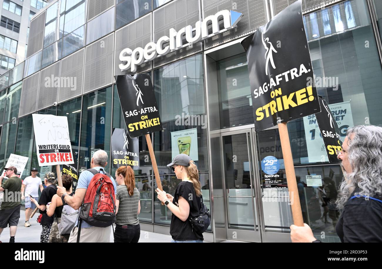 Picketers carry signs outside Amazon and HBO studios on Tuesday, July ...
