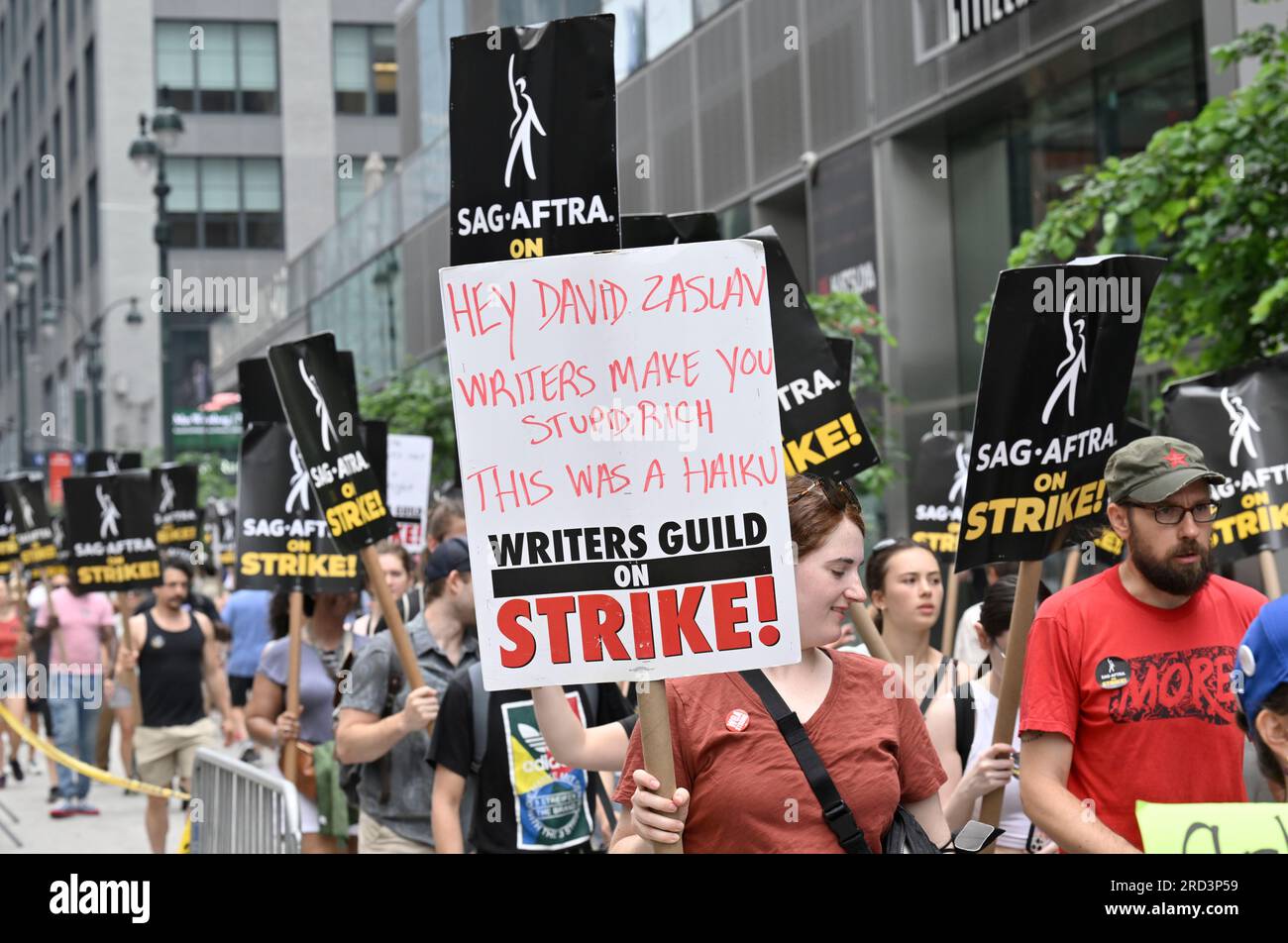 Picketers carry signs outside Amazon and HBO studios on Tuesday, July ...