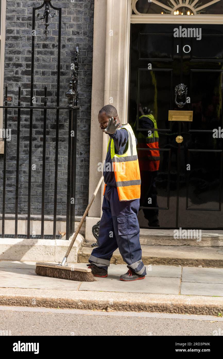 London, UK. 18th July, 2023. Street sweeper at 10 Downing Street London ...