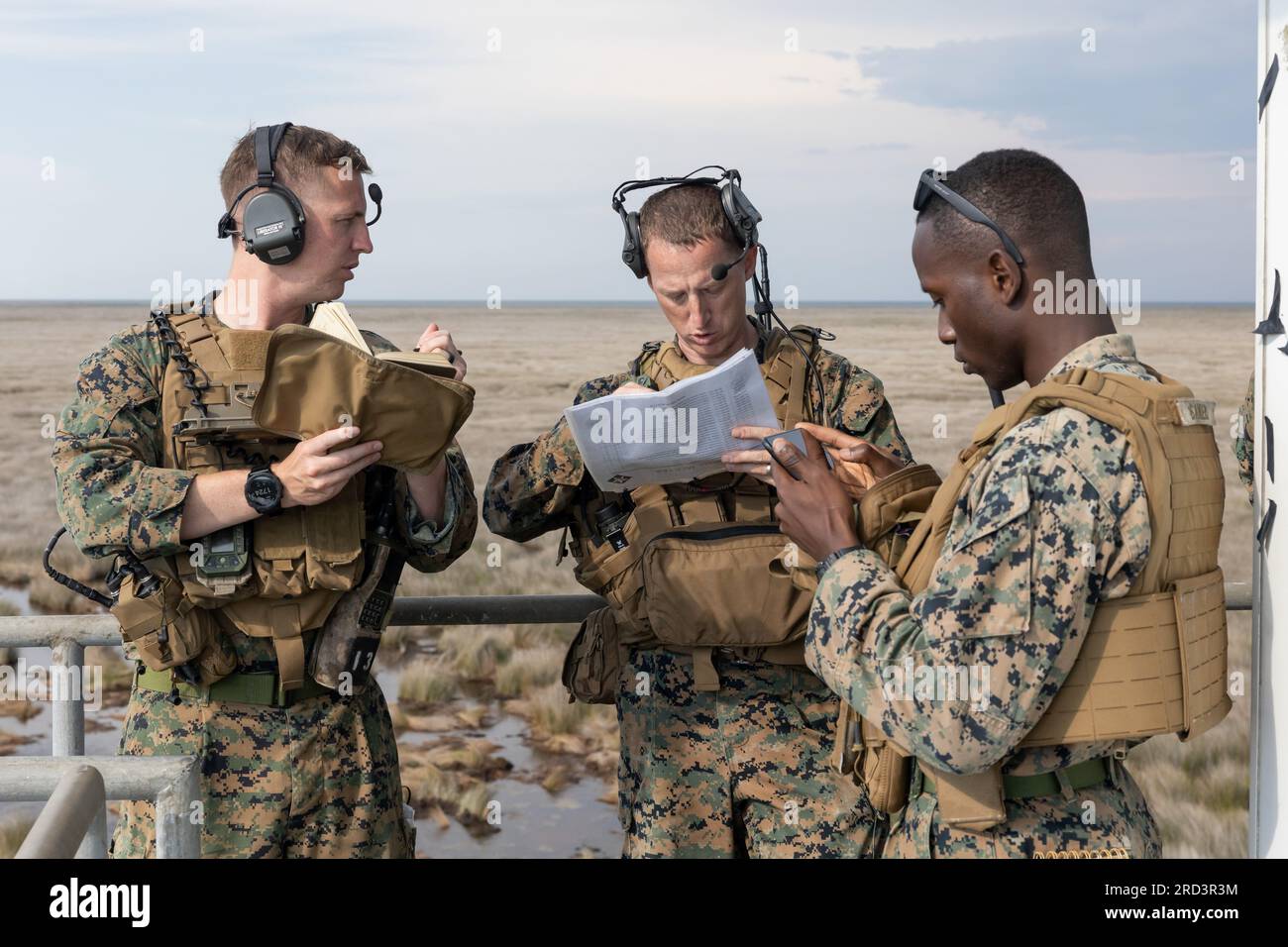 U.S. Marine Corps Capt. Kyle Leonard (left), an assistant air officer ...