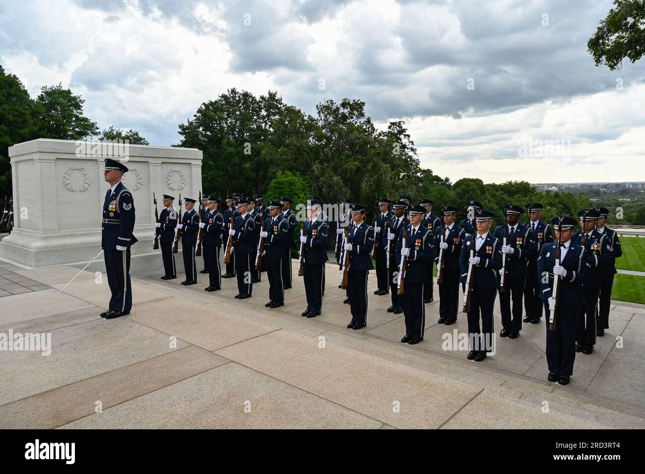 Air Force honor guards stand at attention during a wreath-laying ...