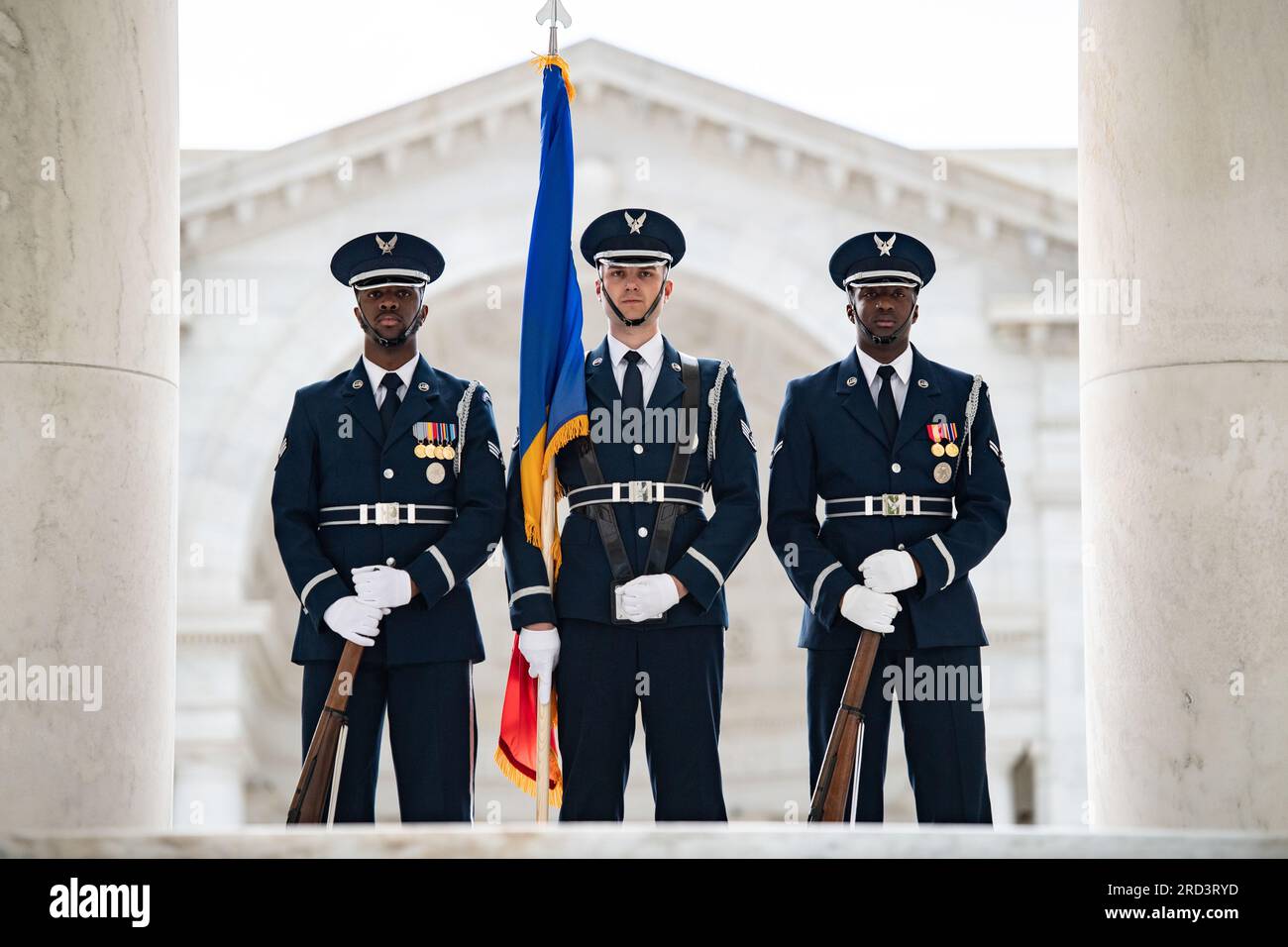 A U.S. Air Force color guard holds the flag of Romania in the Memorial ...