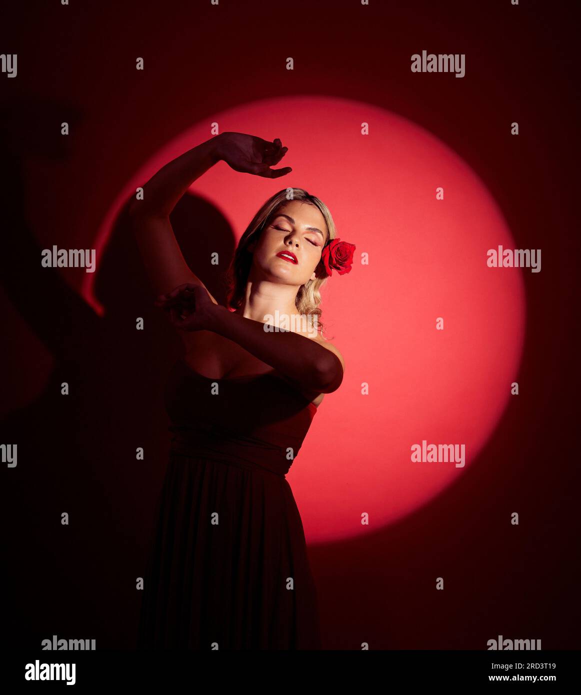 Vintage, creative and a woman in a spotlight on a studio background for ...