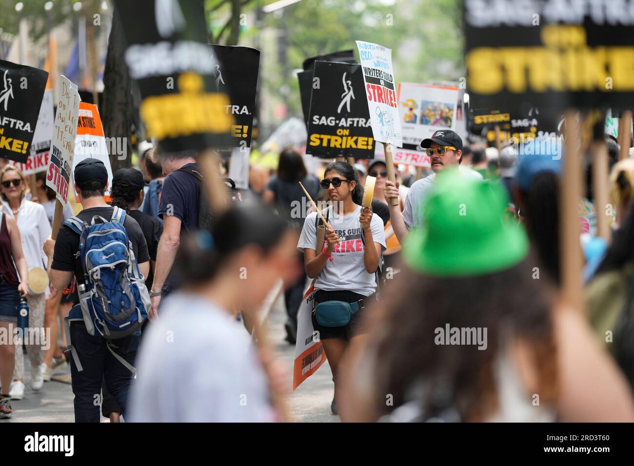 Picketers carry signs outside NBC in Rockefeller Center on Tuesday ...