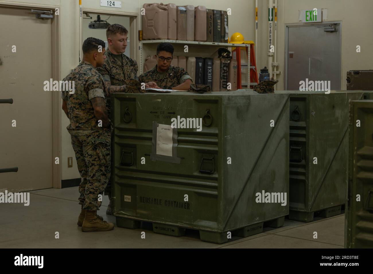 U.S. Marines with 12th Marine Regiment prepare documents for a Marine ...