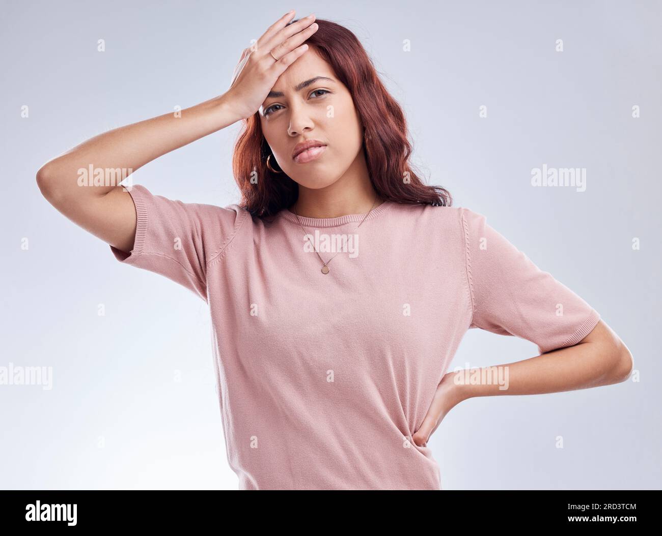 Mistake, regret and young woman in studio with hand on head for anxiety ...