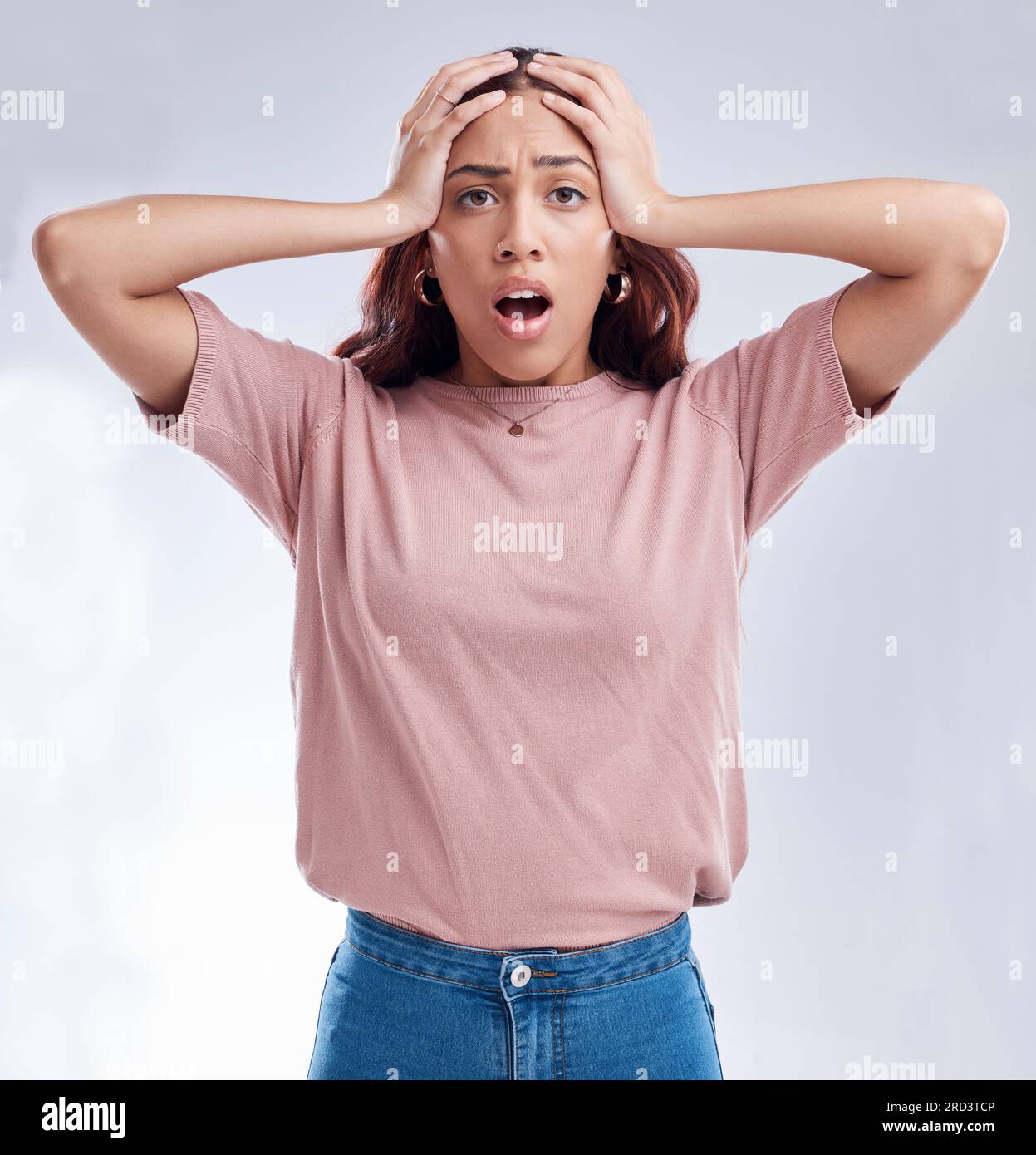 Woman with hands on head, surprise and stress, reaction in portrait ...