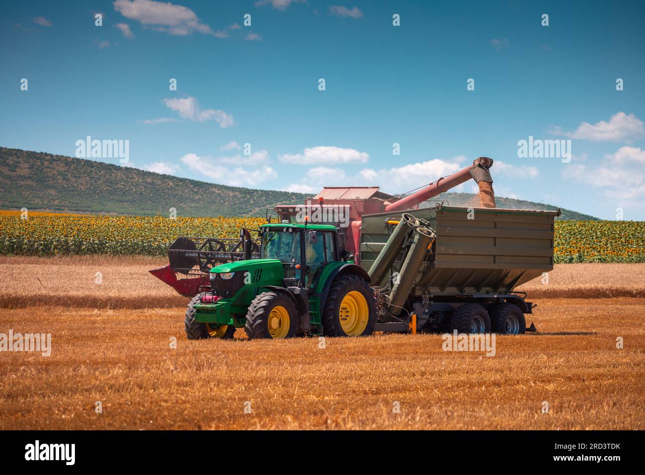 Combine harvester at work in a field hi-res stock photography and ...