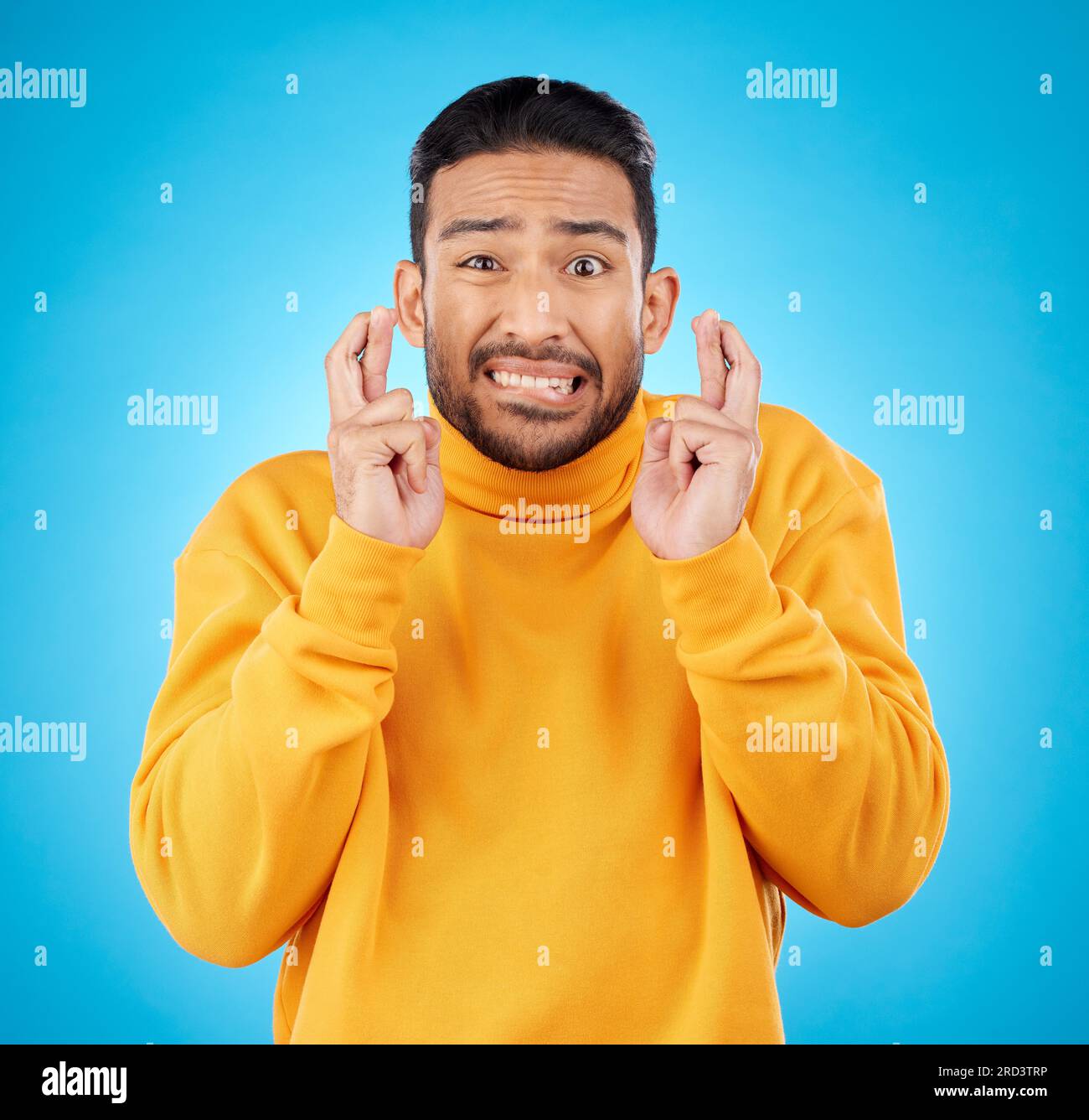 Nervous, portrait and fingers crossed by asian man with anxiety in ...