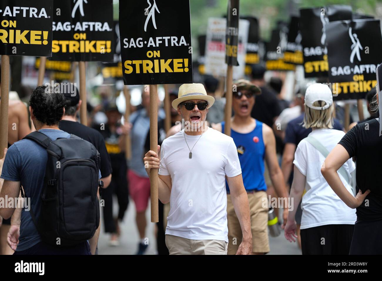 Picketers carry signs outside NBC in Rockefeller Center on Tuesday ...