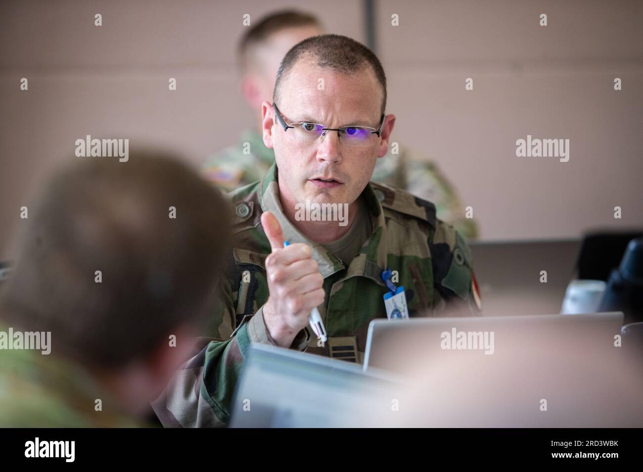 Capt. G. Blaise, with the French army 48th Signal Regiment, talks with ...