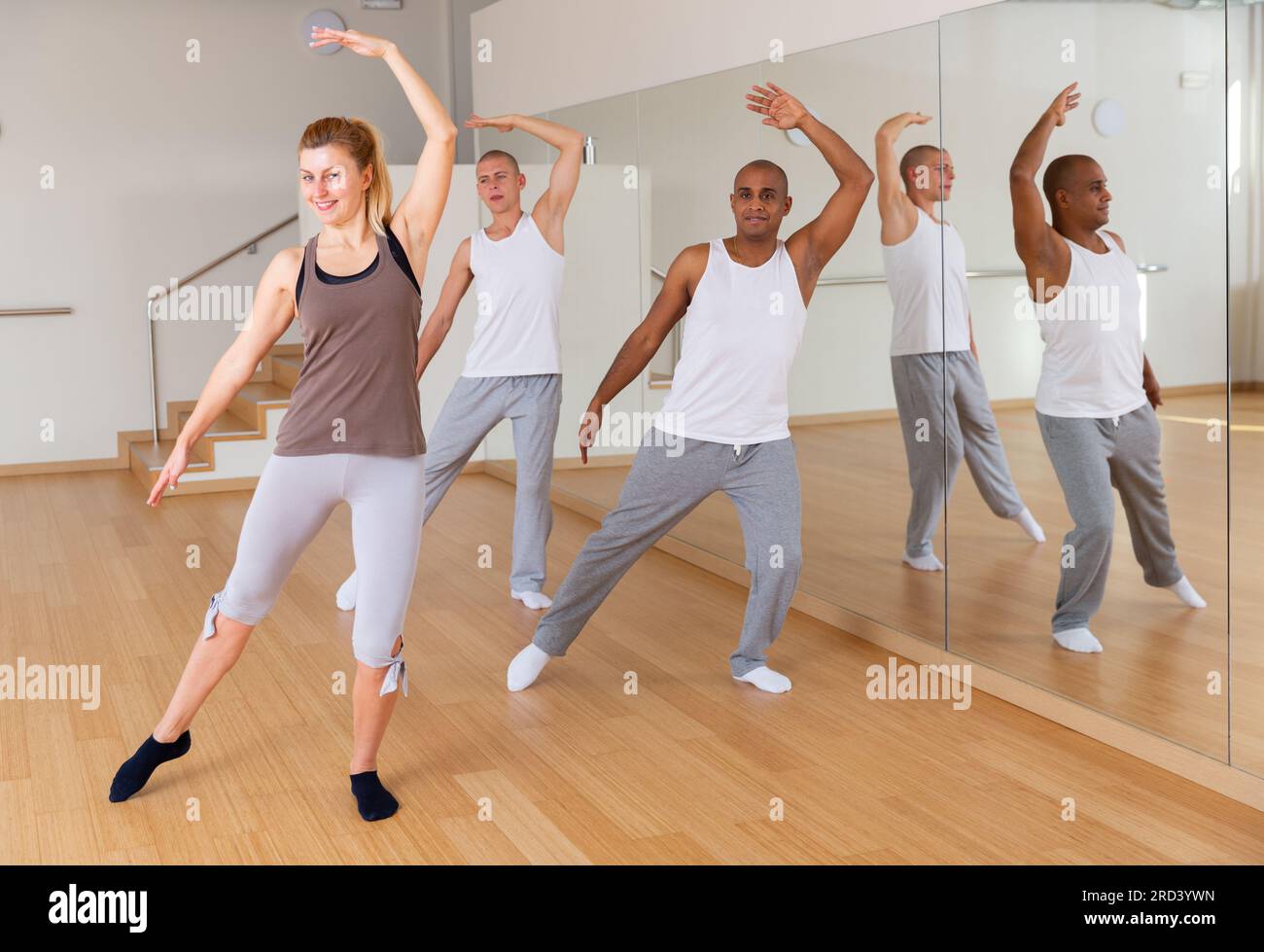 Woman dancing at group lesson in studio Stock Photo - Alamy