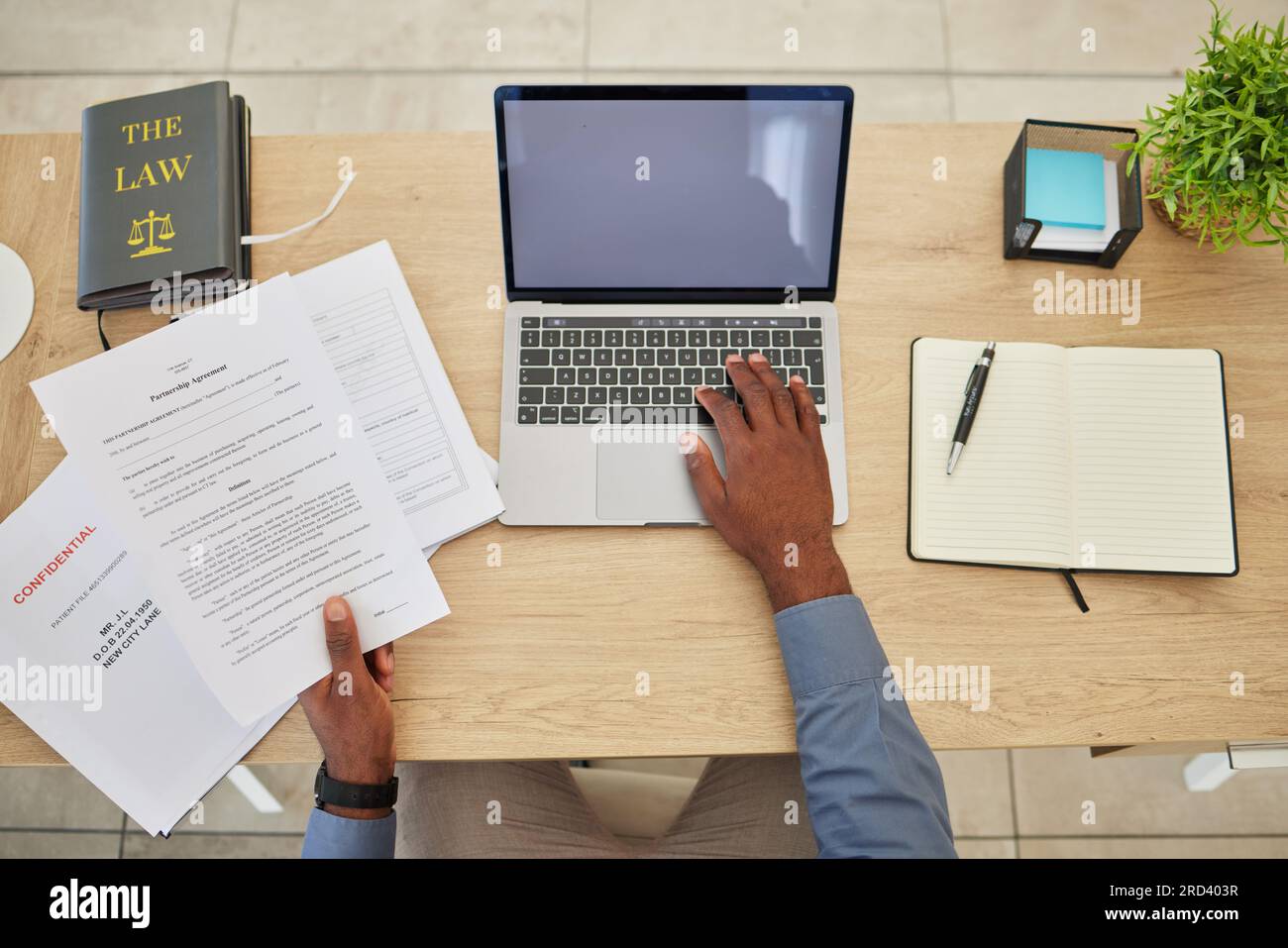 Legal paperwork, lawyer hands and top view of desk, laptop mockup with ...