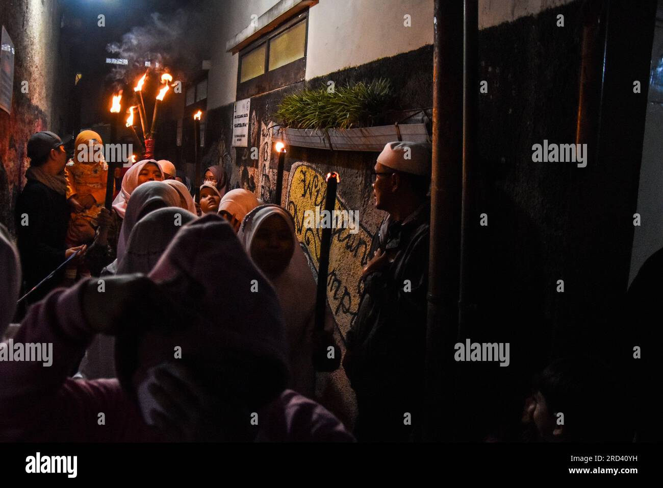 Bandung, West Java, Indonesia. July 18, 2023. Residents light torches ...