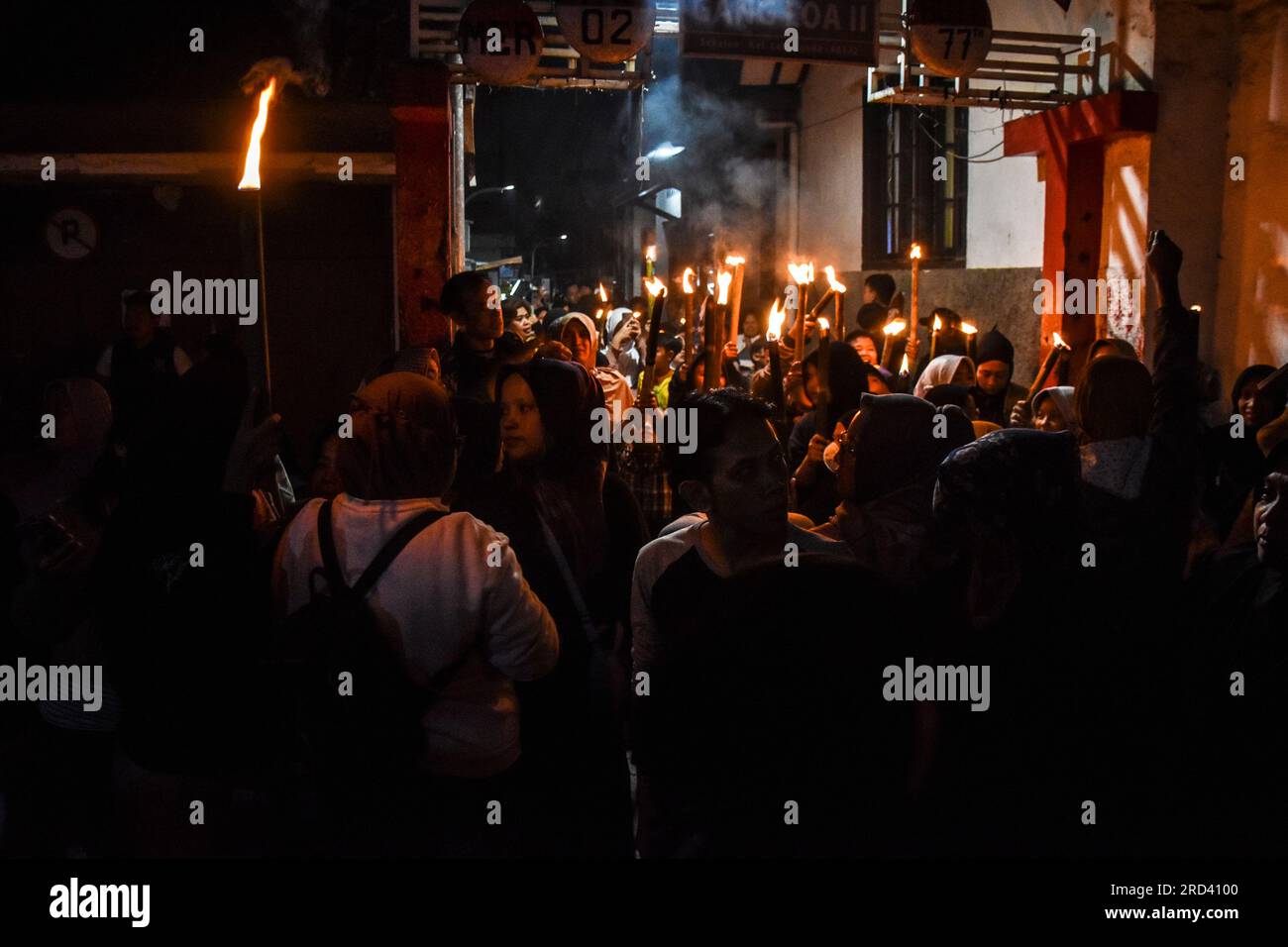 Bandung, West Java, Indonesia. July 18, 2023. Residents light torches ...