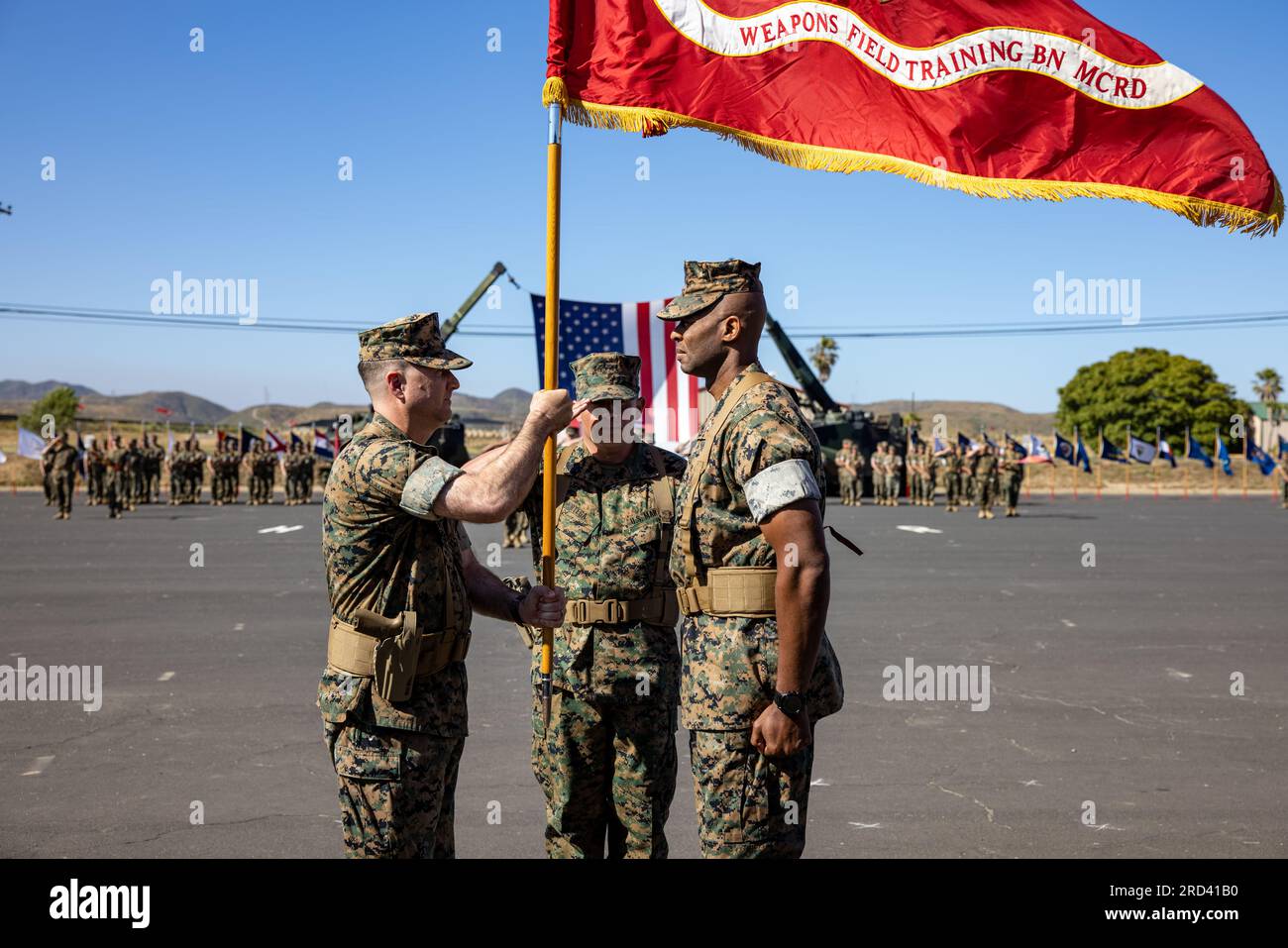 U.S. Marine Corps Col. Carlos Jackson, right, passes the colors to Col ...