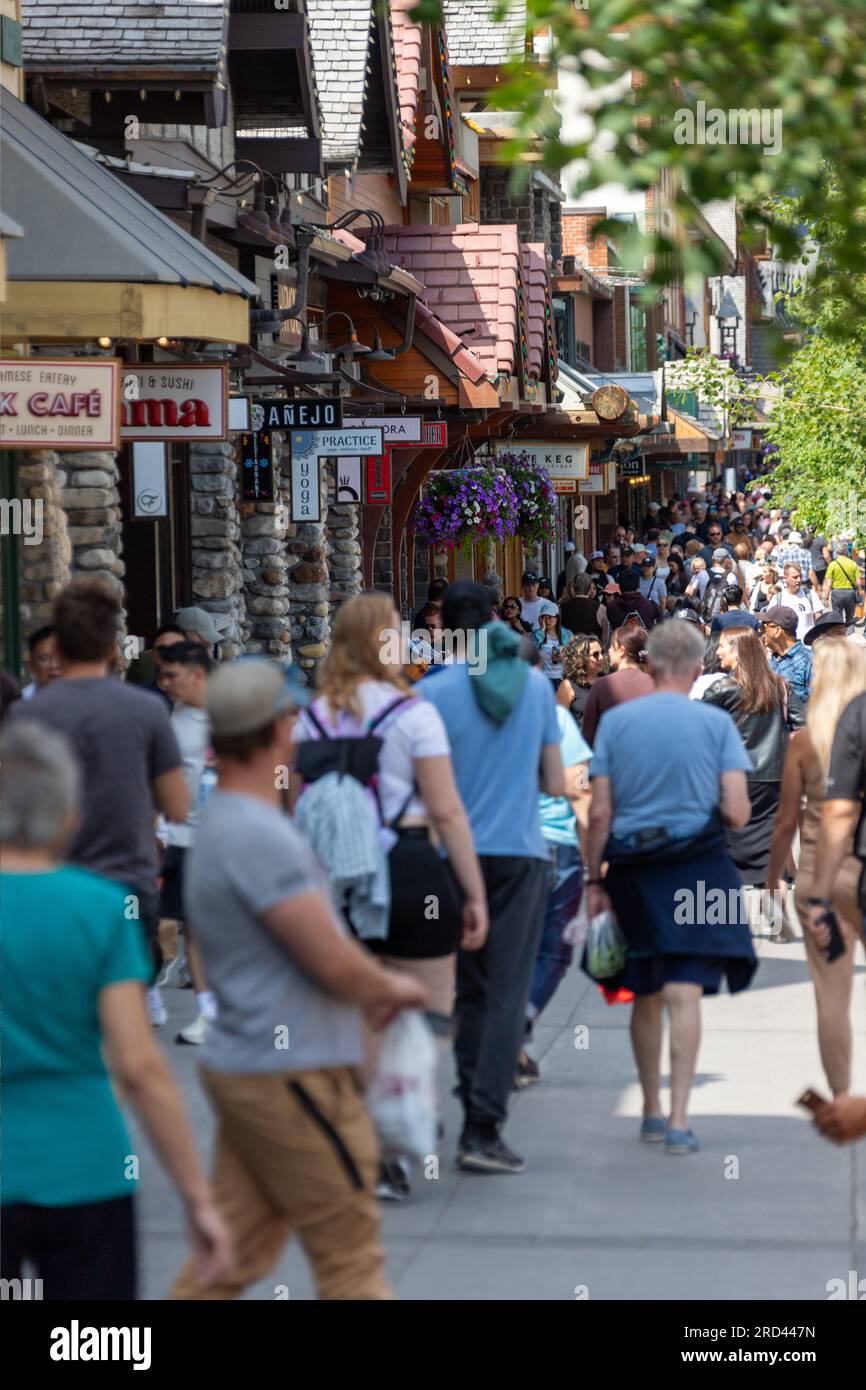 BANFF, CANADA - JULY 5, 2023: Tourists enjoying Banff townsite in the ...