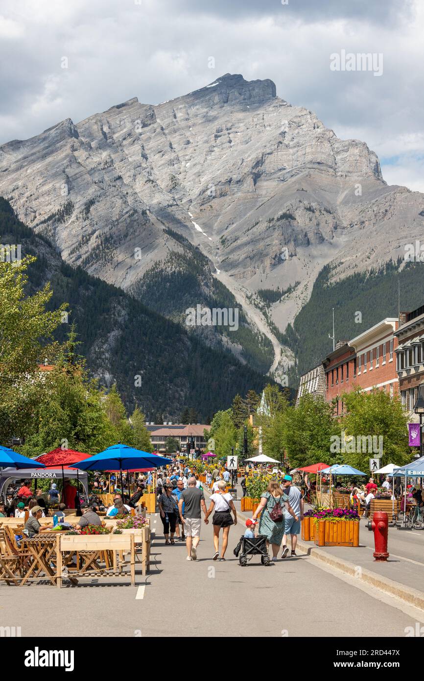 BANFF, CANADA - JULY 5, 2023: Tourists enjoying Banff townsite in the ...