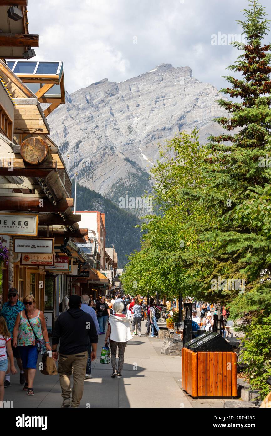 BANFF, CANADA - JULY 5, 2023: Tourists enjoying Banff townsite in the ...