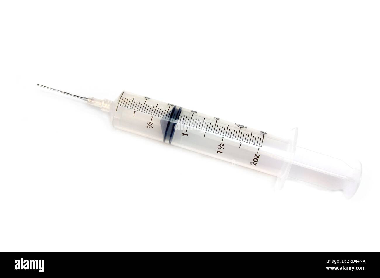 Hyperdermic needle lays ready for physician's orders. All white ...