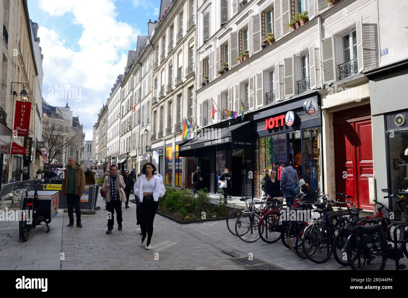 Paris, France - March 18, 2023: People at cobbled pedestrian street in ...