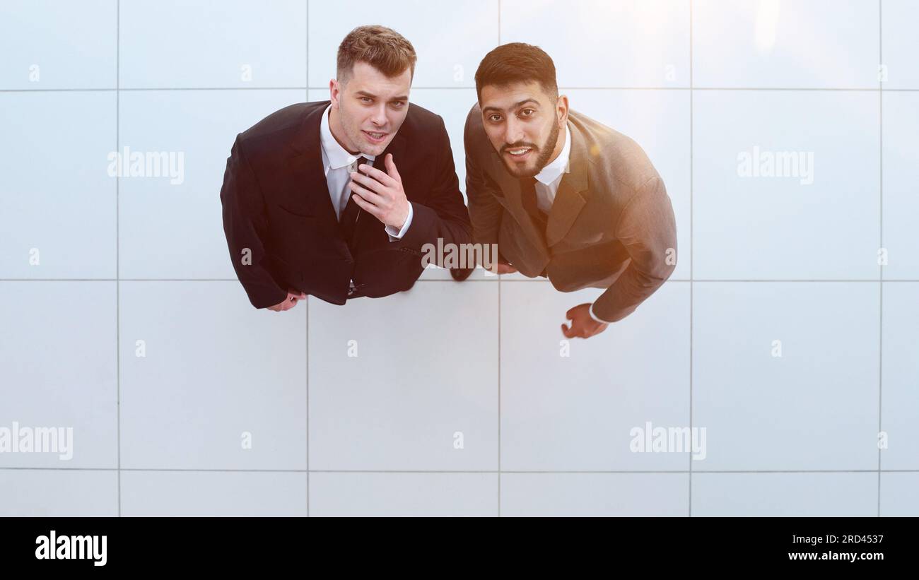 Portrait of two concentrated businessmen partners dressed in formal ...