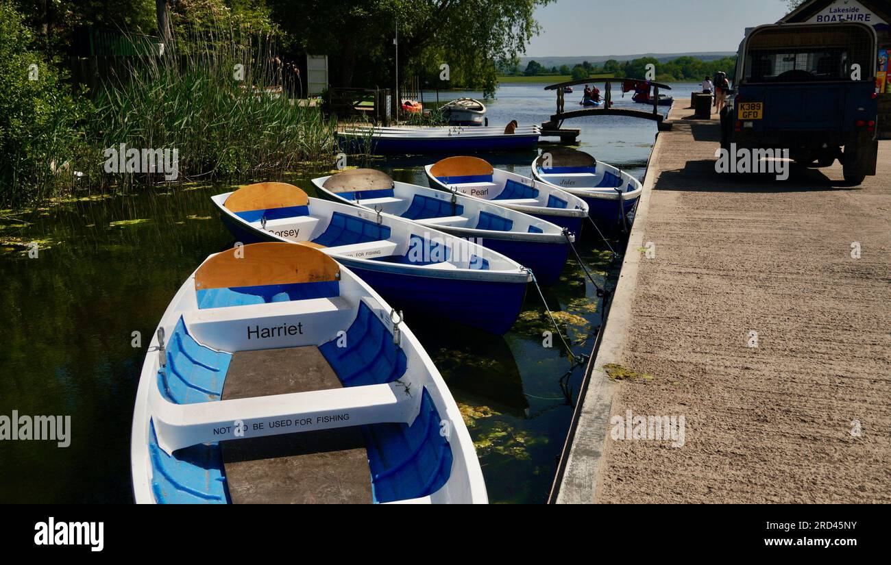 Empty rowing boats lined up waiting to be hired for trips around ...