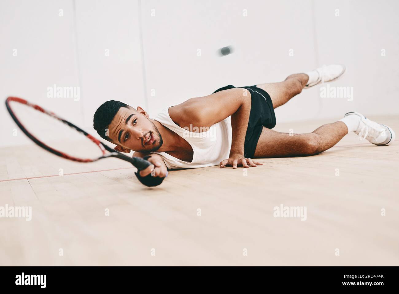 Nothing puts you through your paces like squash. Shot of a young man ...