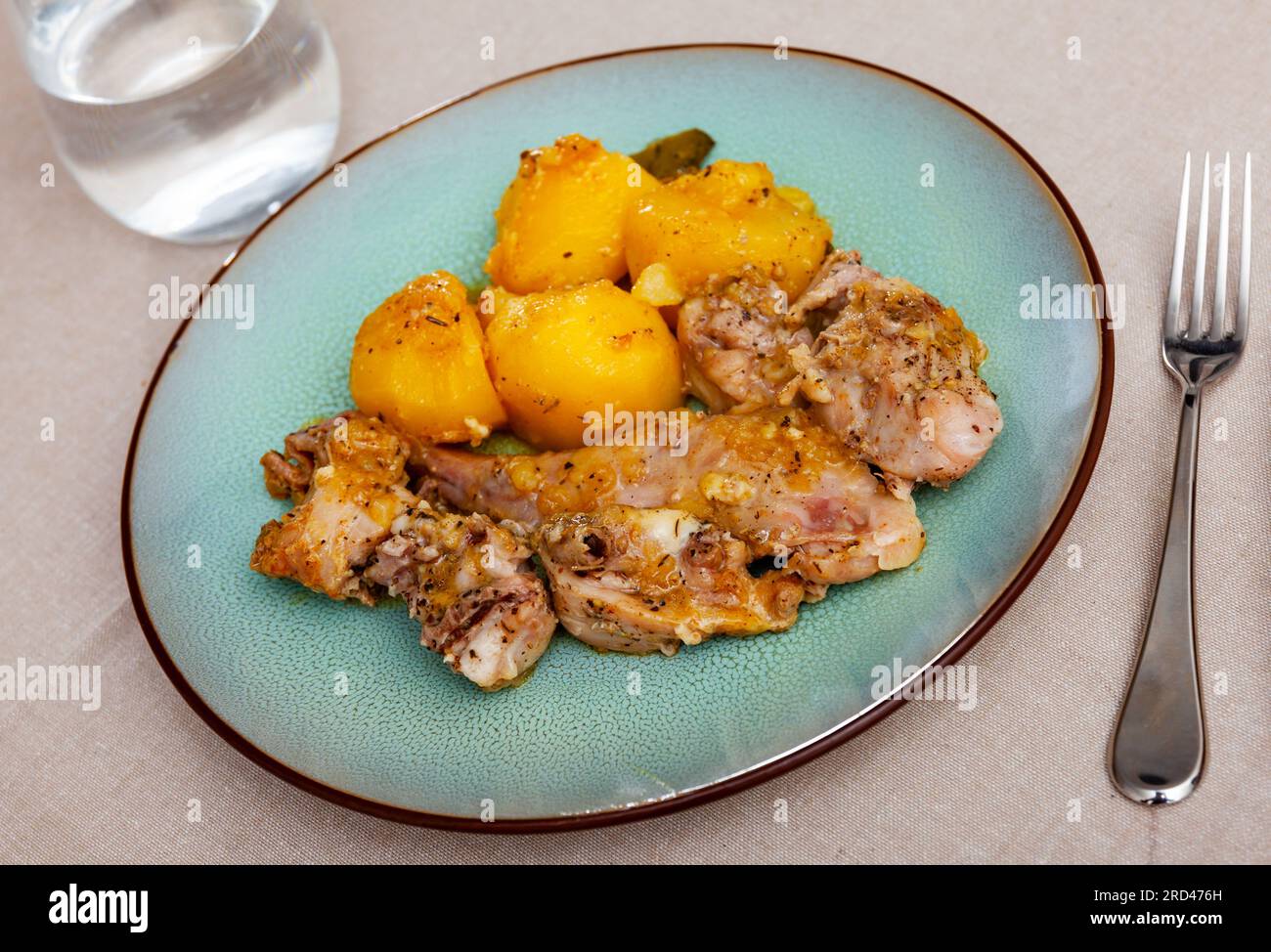 Dish of stewed rabbit and potatoes Stock Photo - Alamy