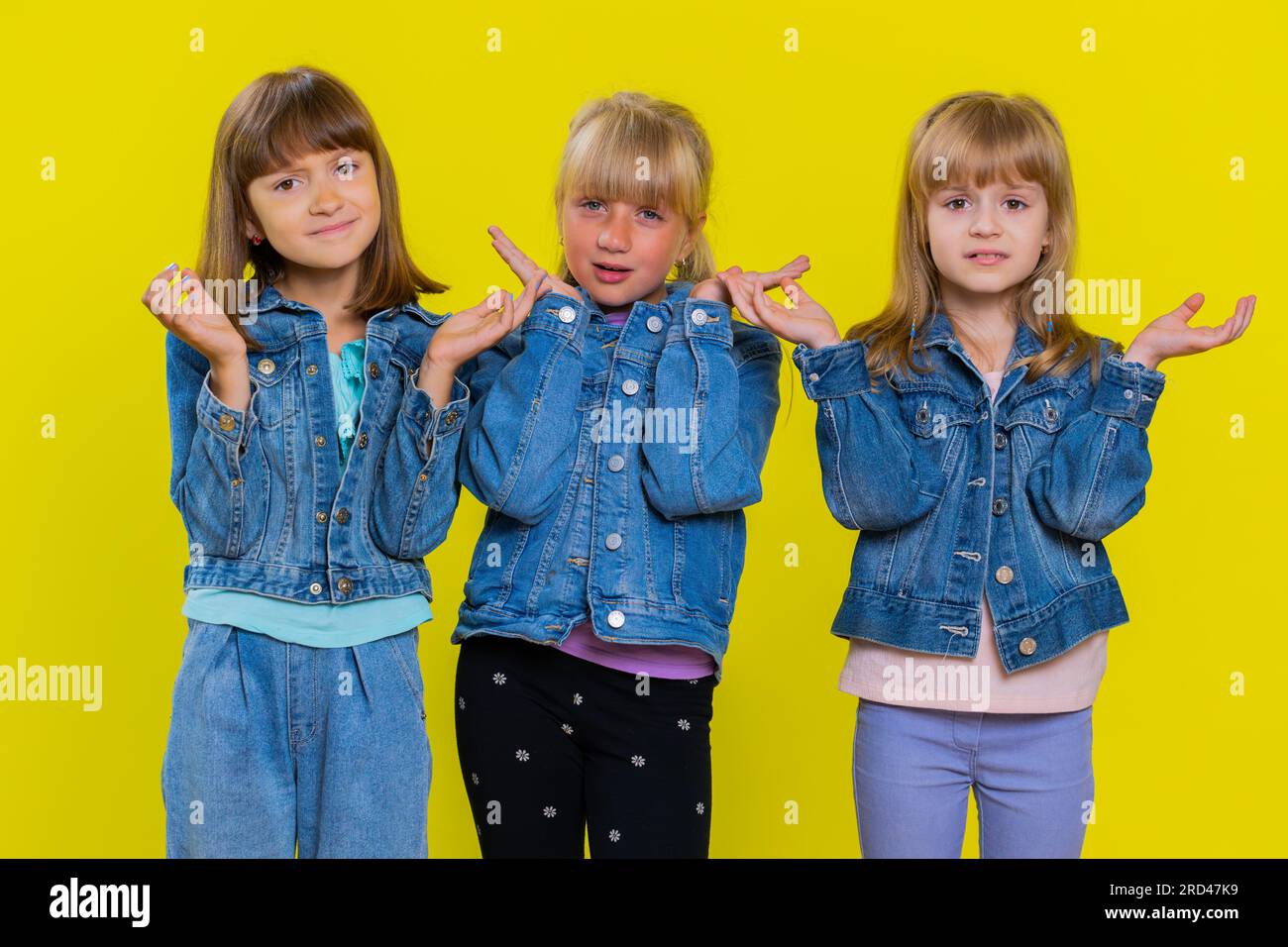 What. Why. Teenage girls raising hands in indignant expression, asking ...