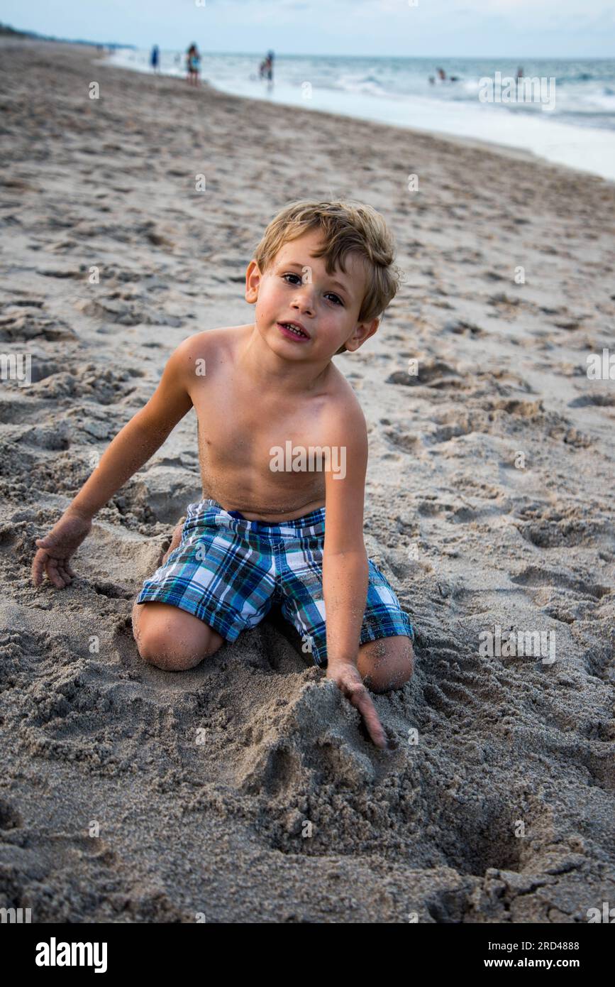 Young Boy on the Beach Stock Photo - Alamy