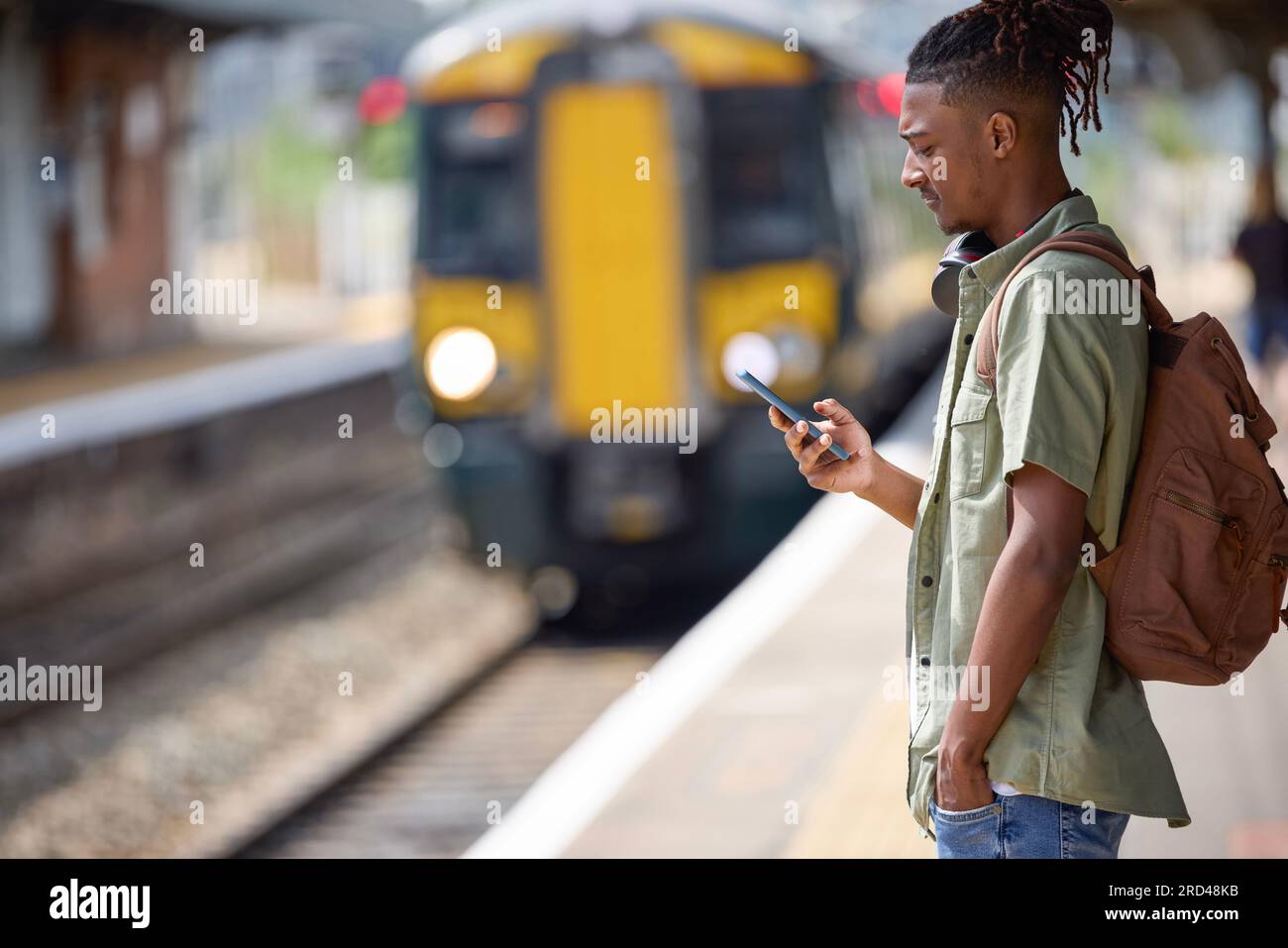 Black person train platform hi-res stock photography and images - Alamy