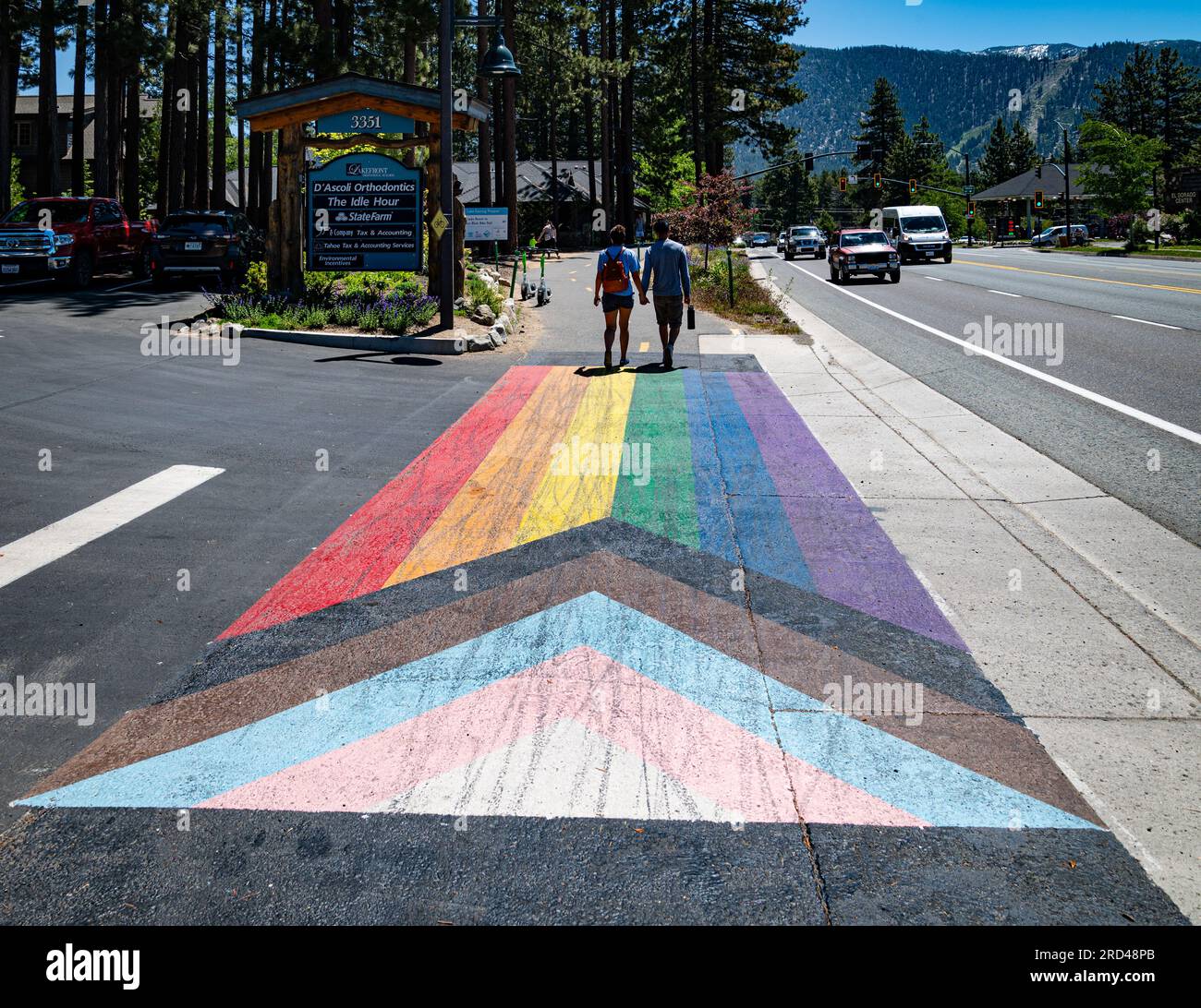 People walking on a sidewalk area on Lake Tahoe Blvd, where the local ...